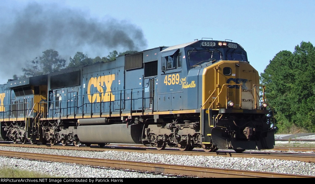 CSX 4589 SD70MAC X-CSX 7989 X-CR 4144 City of Nashville roaring southbound through the CSX yard ...